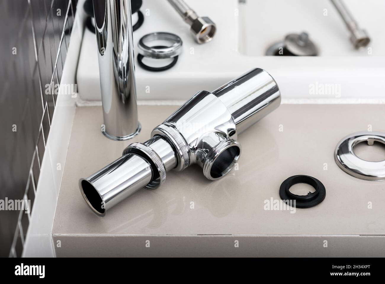new metal siphon and other sink equipments in the bathroom Stock Photo ...