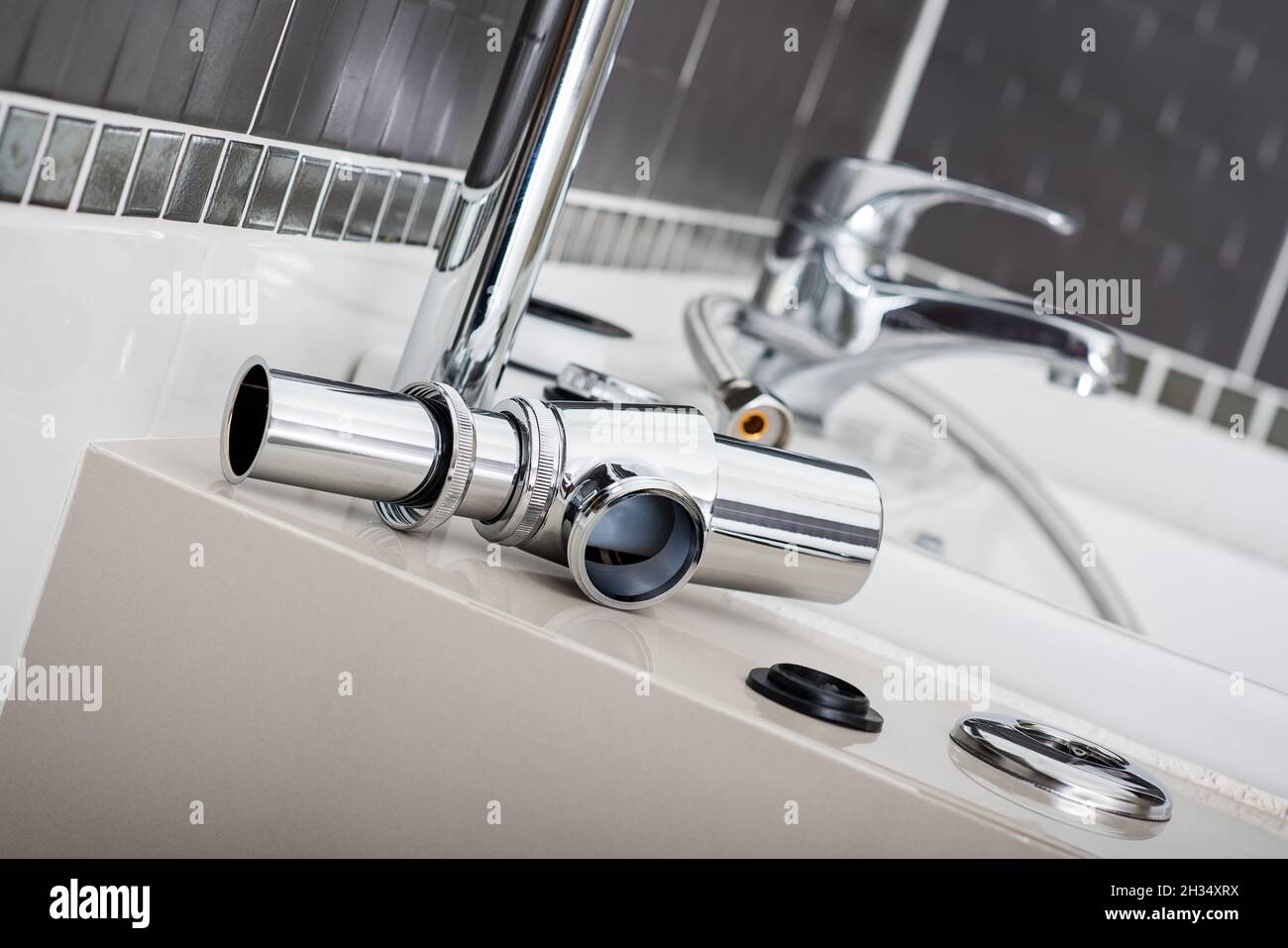 new metal siphon and other sink equipments in the bathroom Stock Photo ...