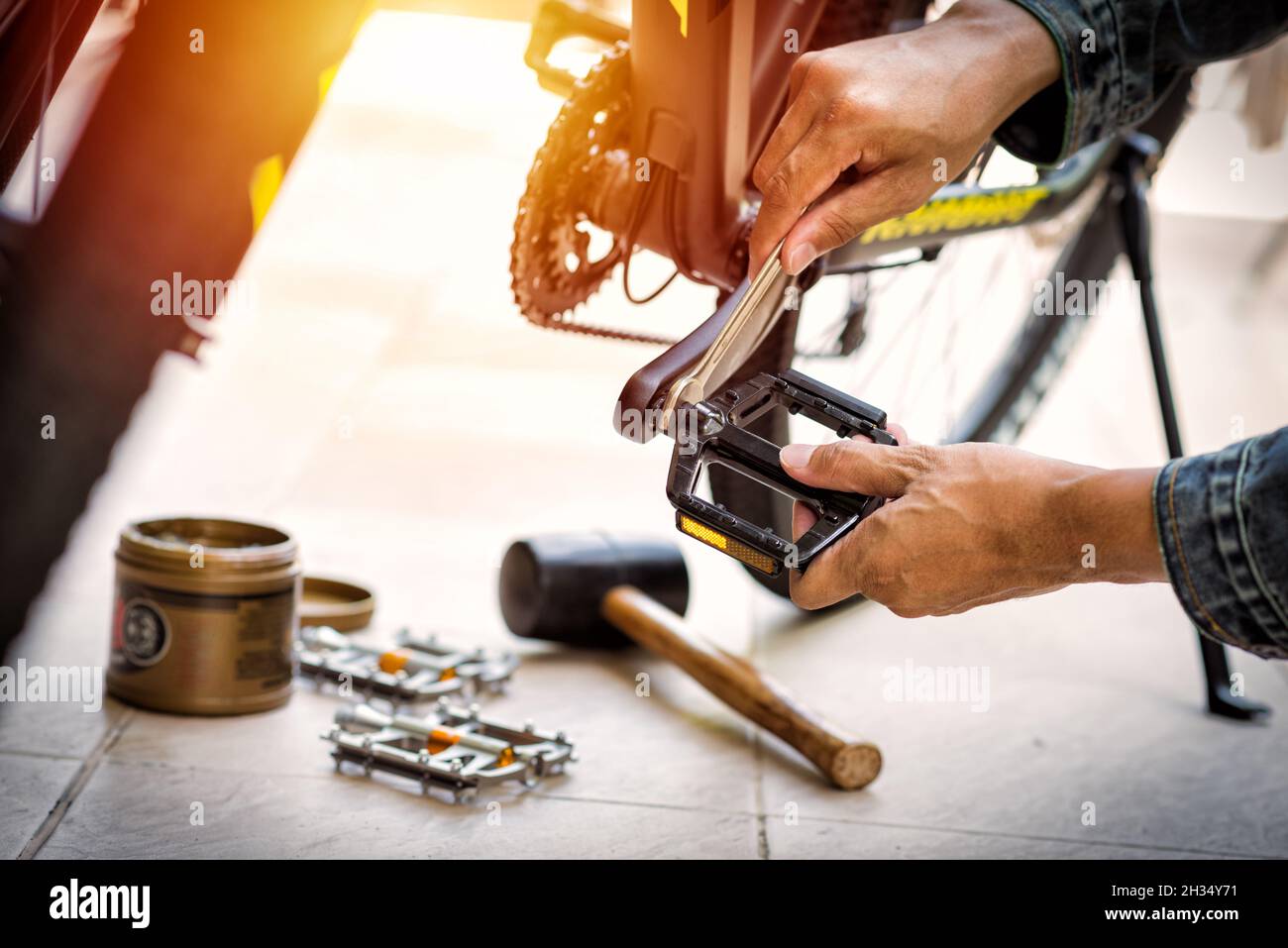 The man changing bike pedals. Mountain bike upgrade concept Stock Photo ...