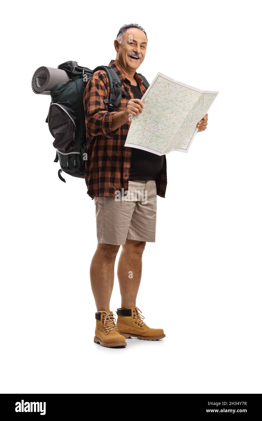 Full length shot of a mature hiker holding a map and smiling isolated ...