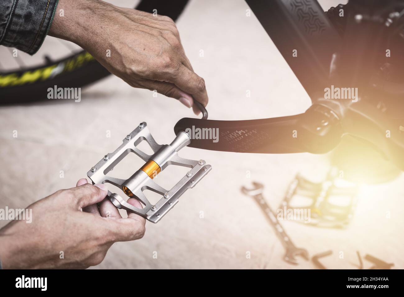 The man changing bike pedals. Mountain bike upgrade concept Stock Photo ...