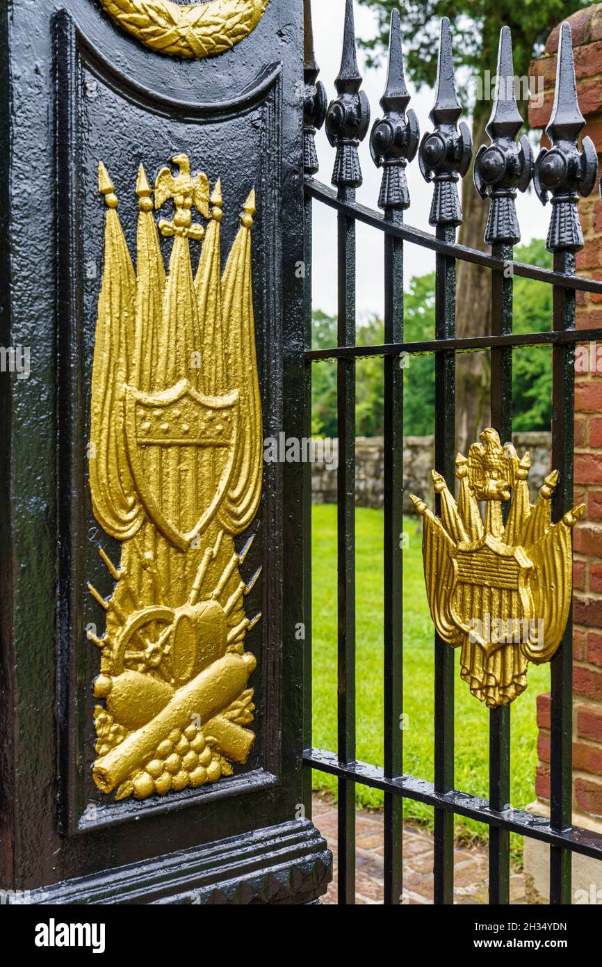 Elaborate gold emblems on the gate of the Shiloh National Cemetery ...