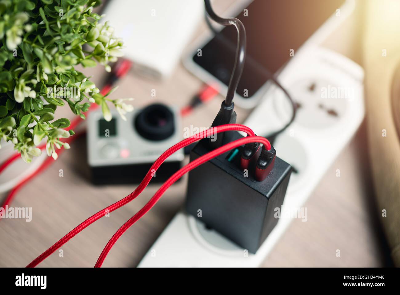 Closeup black charger with 4 usb port output. Charging electronic ...