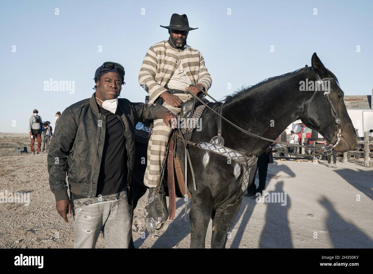 THE HARDER THEY FALL, from left: director Jeymes Samuel, Idris Elba, on ...