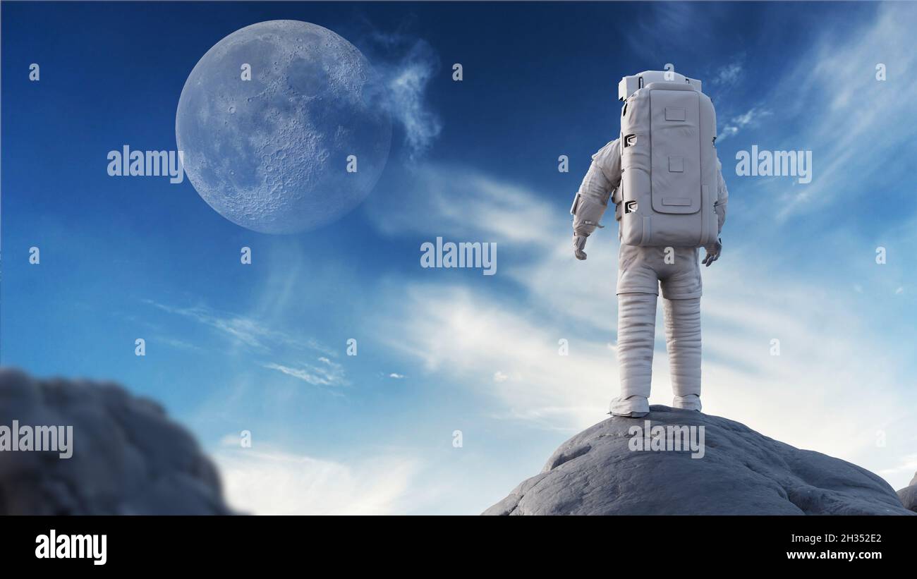 astronaut watching the Moon Stock Photo - Alamy
