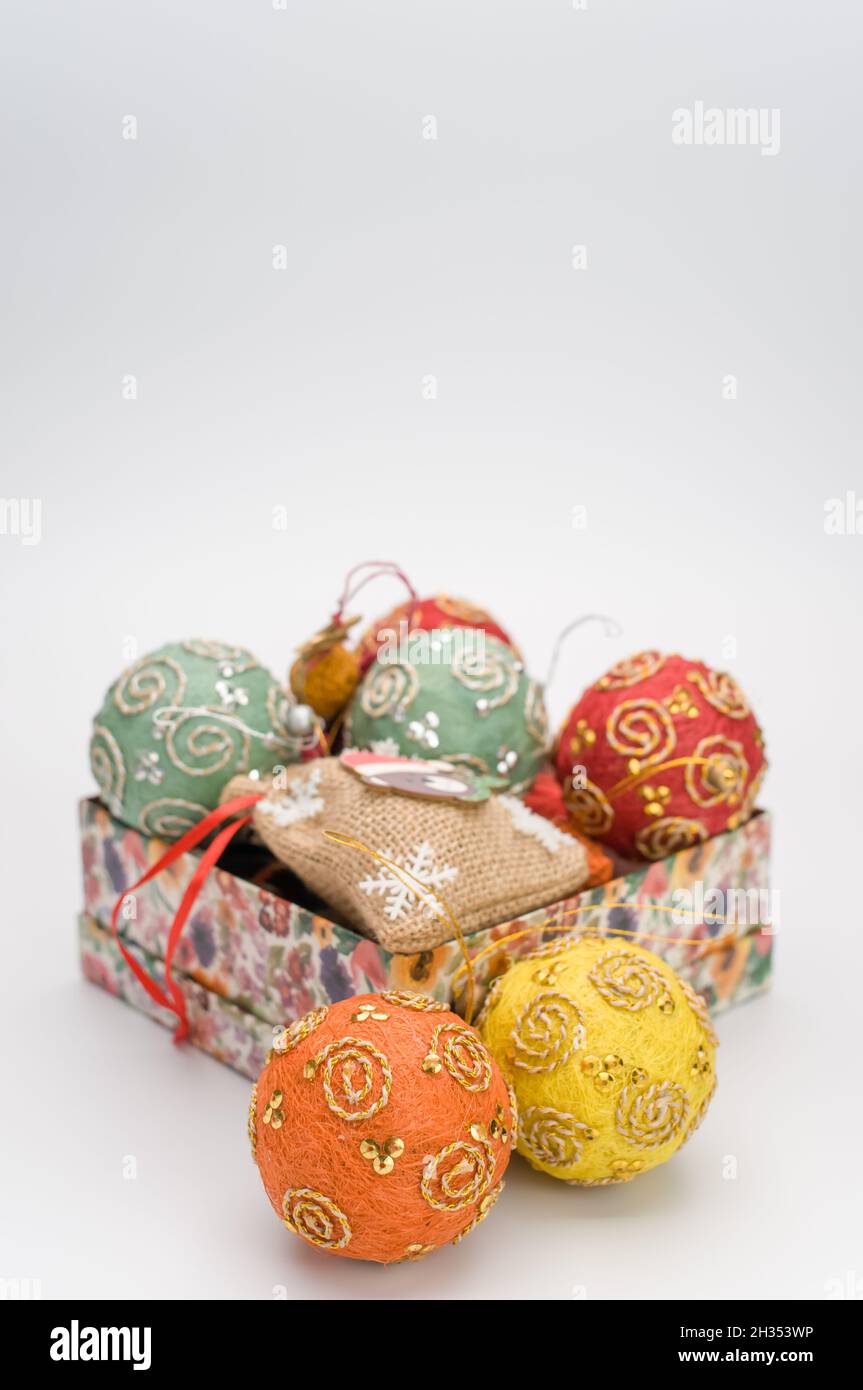 Christmas time decorations in a paperboard box on white background ...