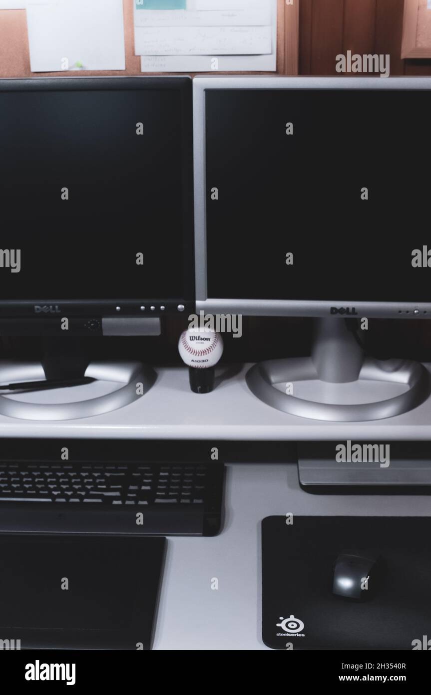 COMO, ITALY - Oct 25, 2021: working time - computers and monitors at ...