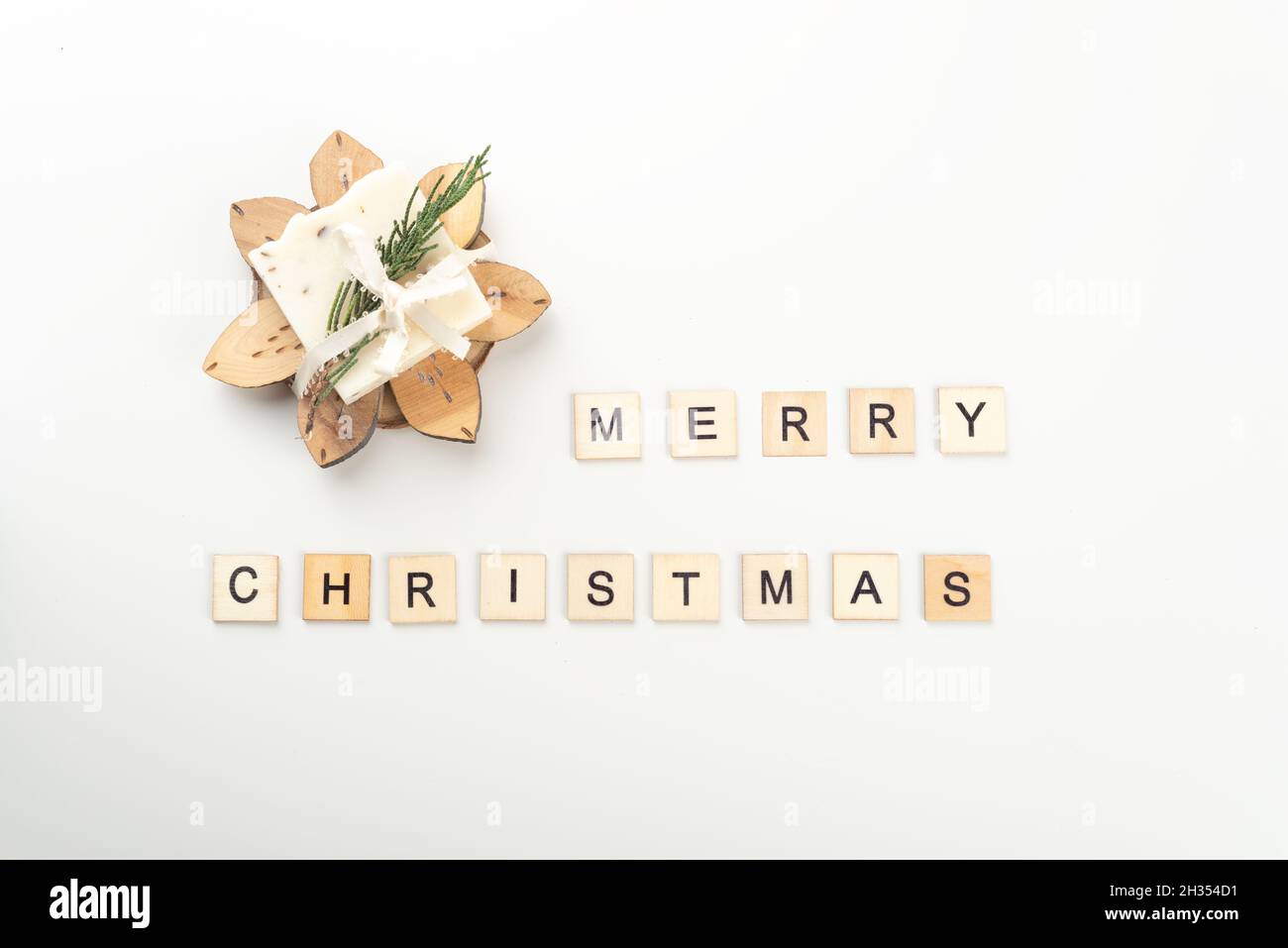 Handmade soap and Merry Christmas letters as a concept of greeting from ...