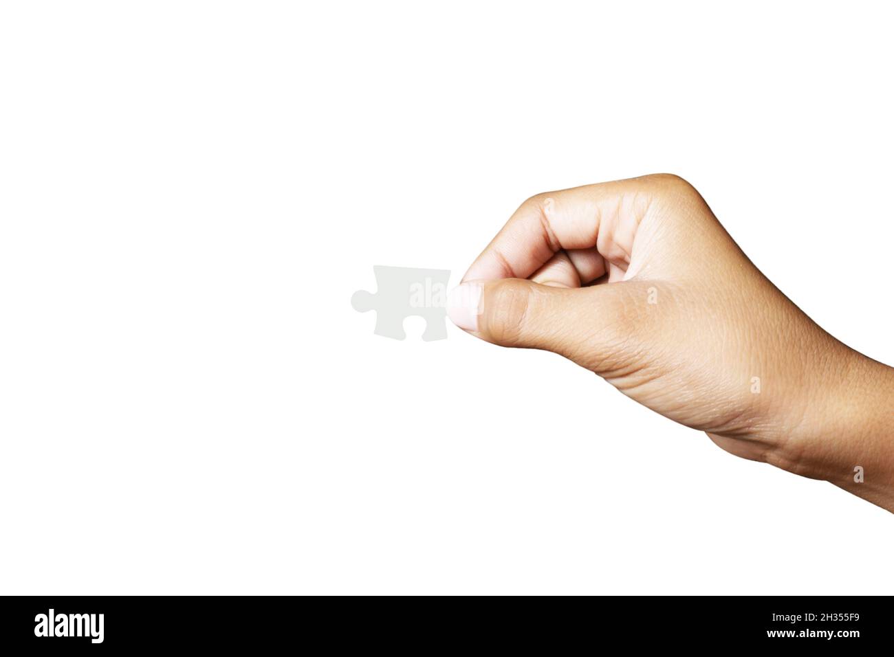 Close up holding one puzzle element isolated on white background. High ...