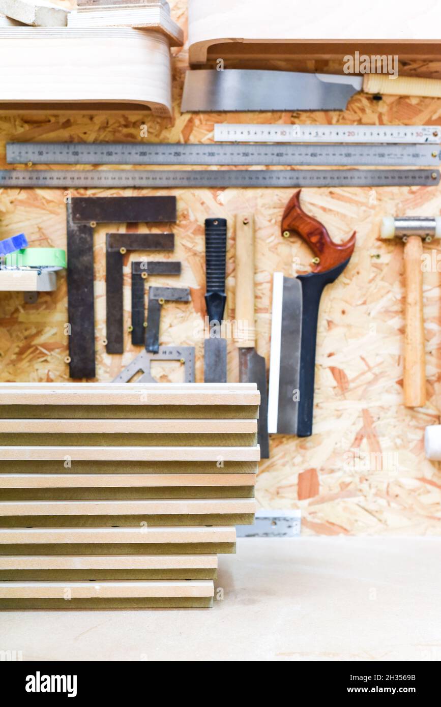 Carpenters workshop interior with wooden planks and work tools of the ...