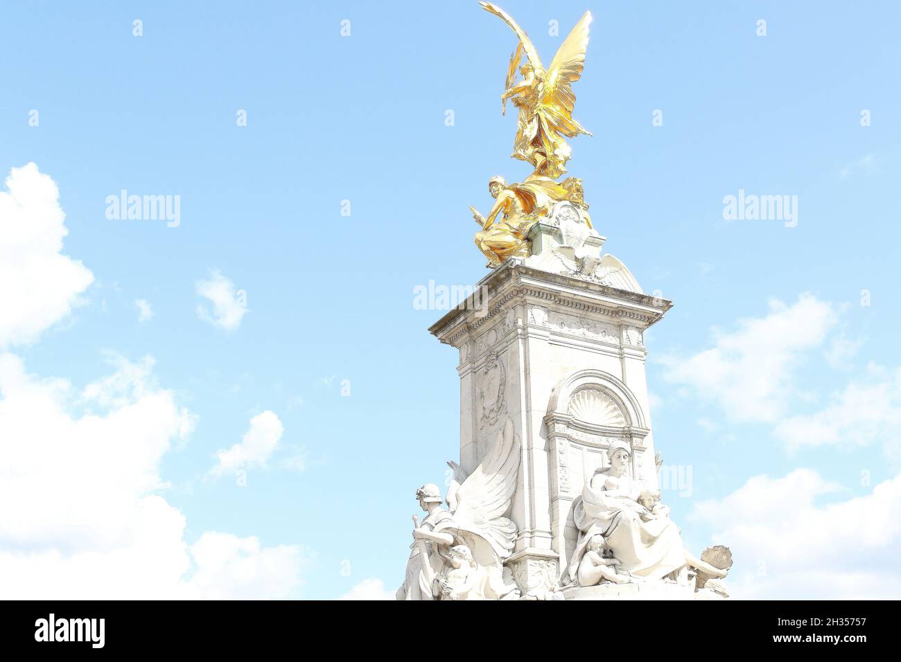 Beautiful shot of golden statues of angels on a tower at the Buckingham ...