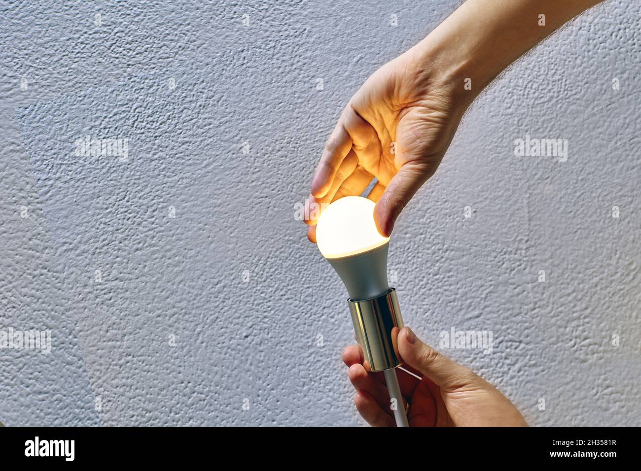 Woman holding replacement light hi-res stock photography and images - Alamy