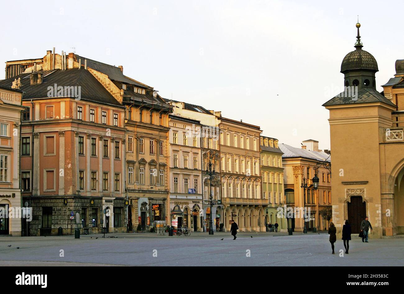 Early morning in the historic old town Main Market Square in Krakow ...