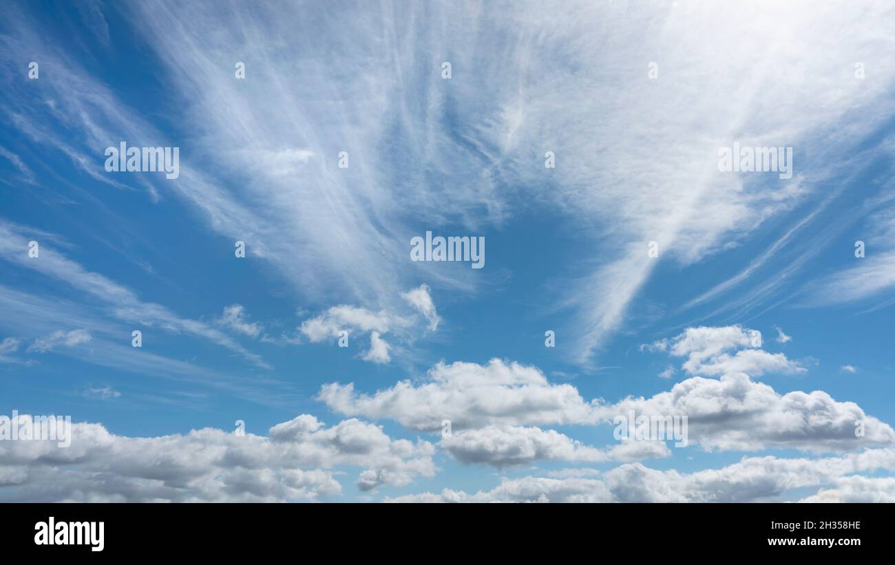 WIspy clouds and blue sky suitable for background Stock Photo - Alamy
