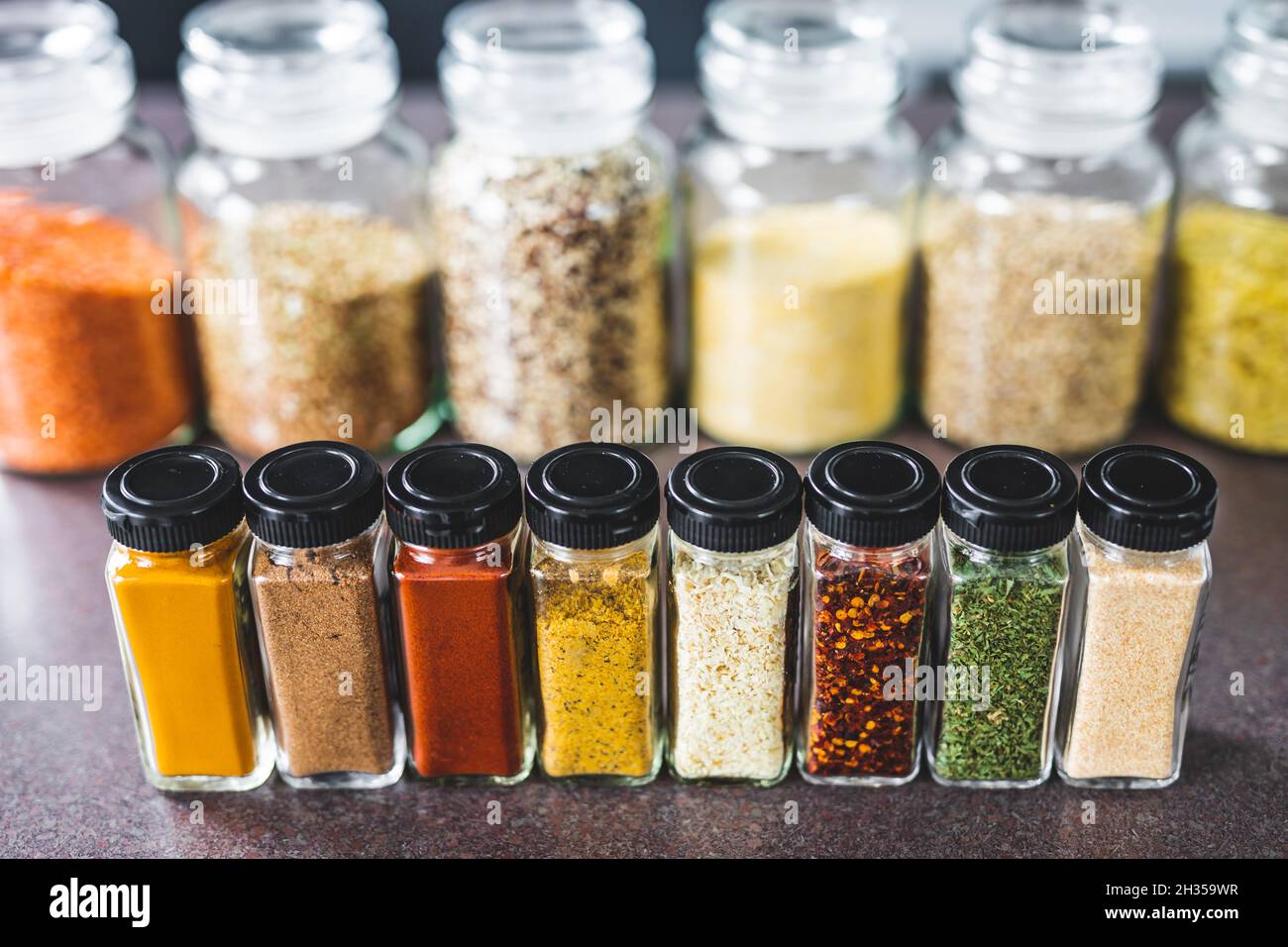 spices and grains in matching spice jars on kitchen counter, simple ...