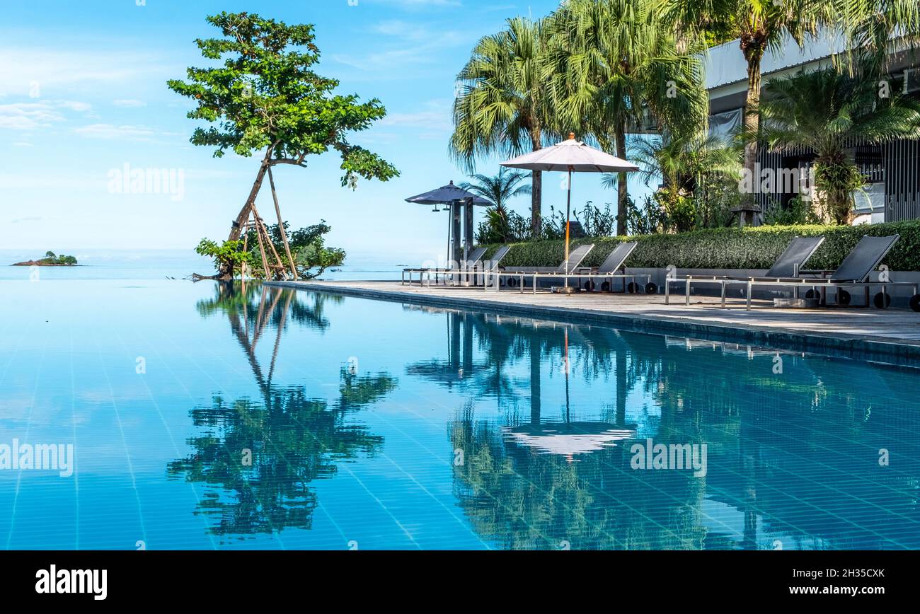 Reflections in an infinity pool at a resort in Thailand Stock Photo - Alamy