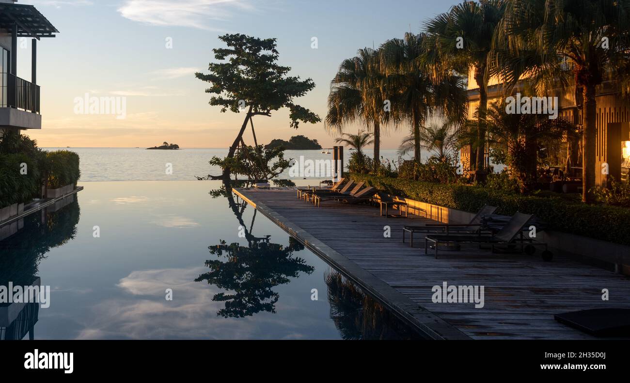 Reflections in an infinity pool at a resort in Thailand Stock Photo - Alamy