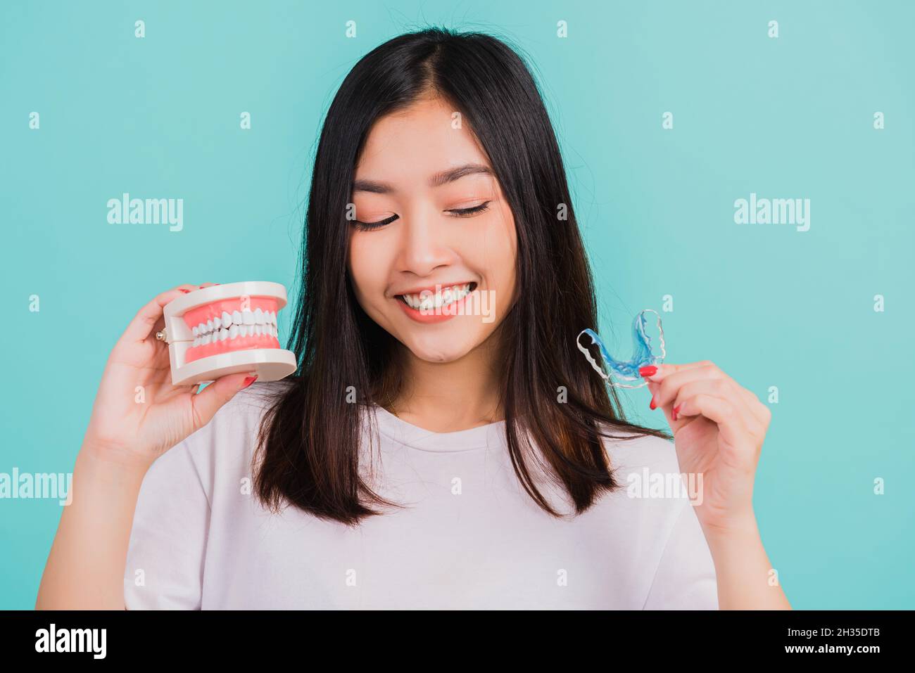 Portrait young Asian beautiful woman smiling holding silicone ...