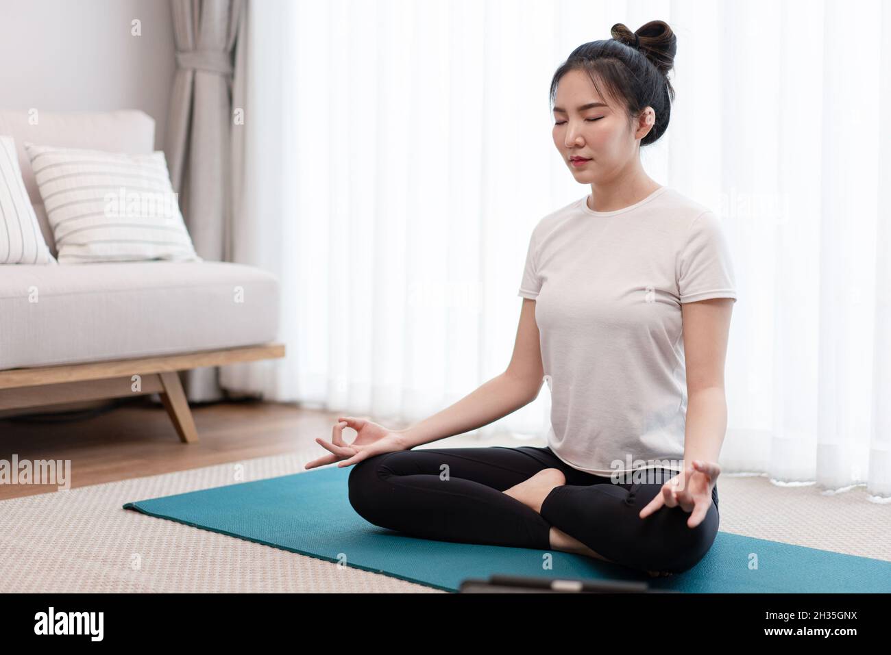 Productive activity concept a calm girl concentrating on meditating ...