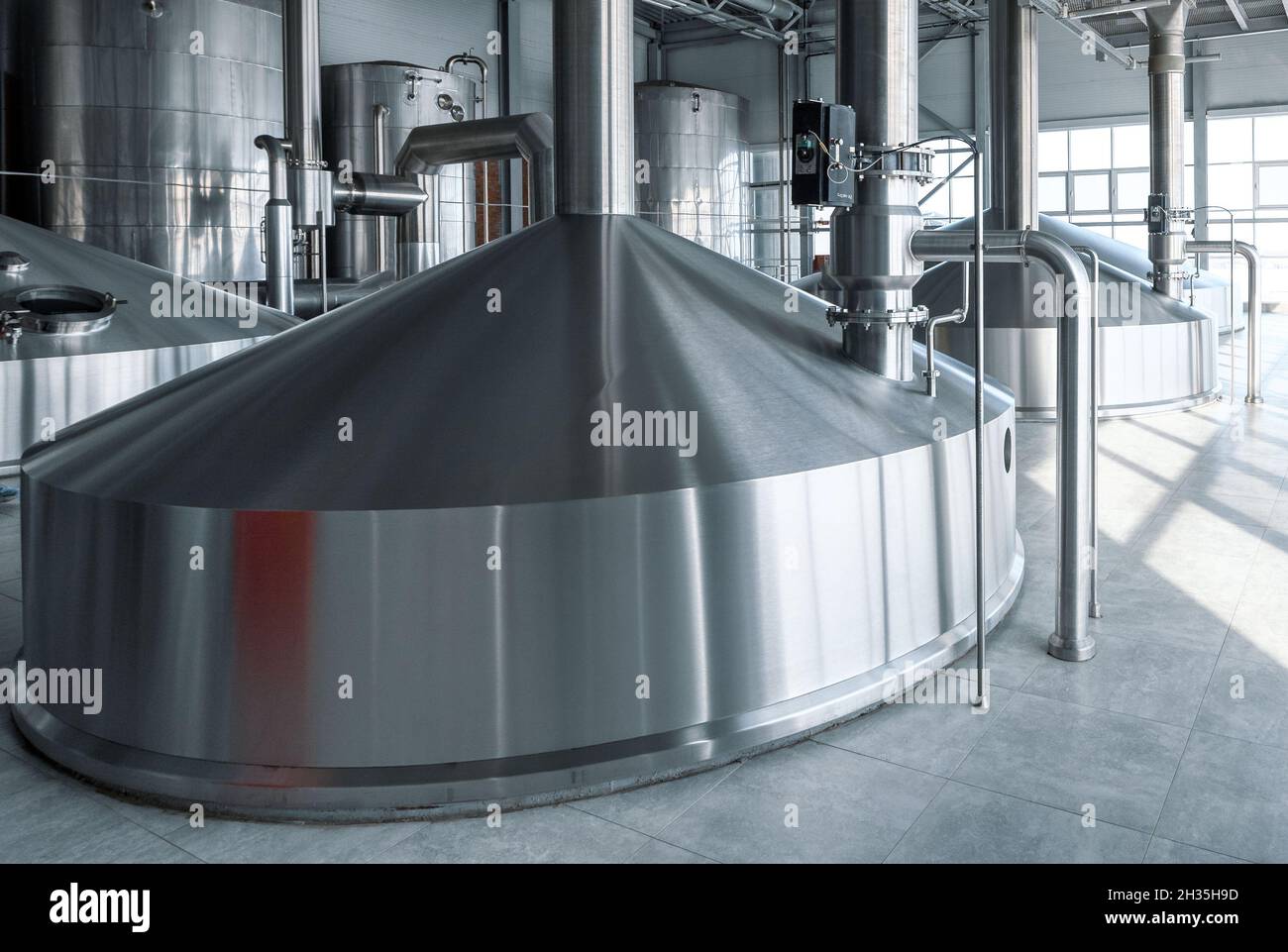 Large steel tanks for fermentation of beer drinks Industrial production ...