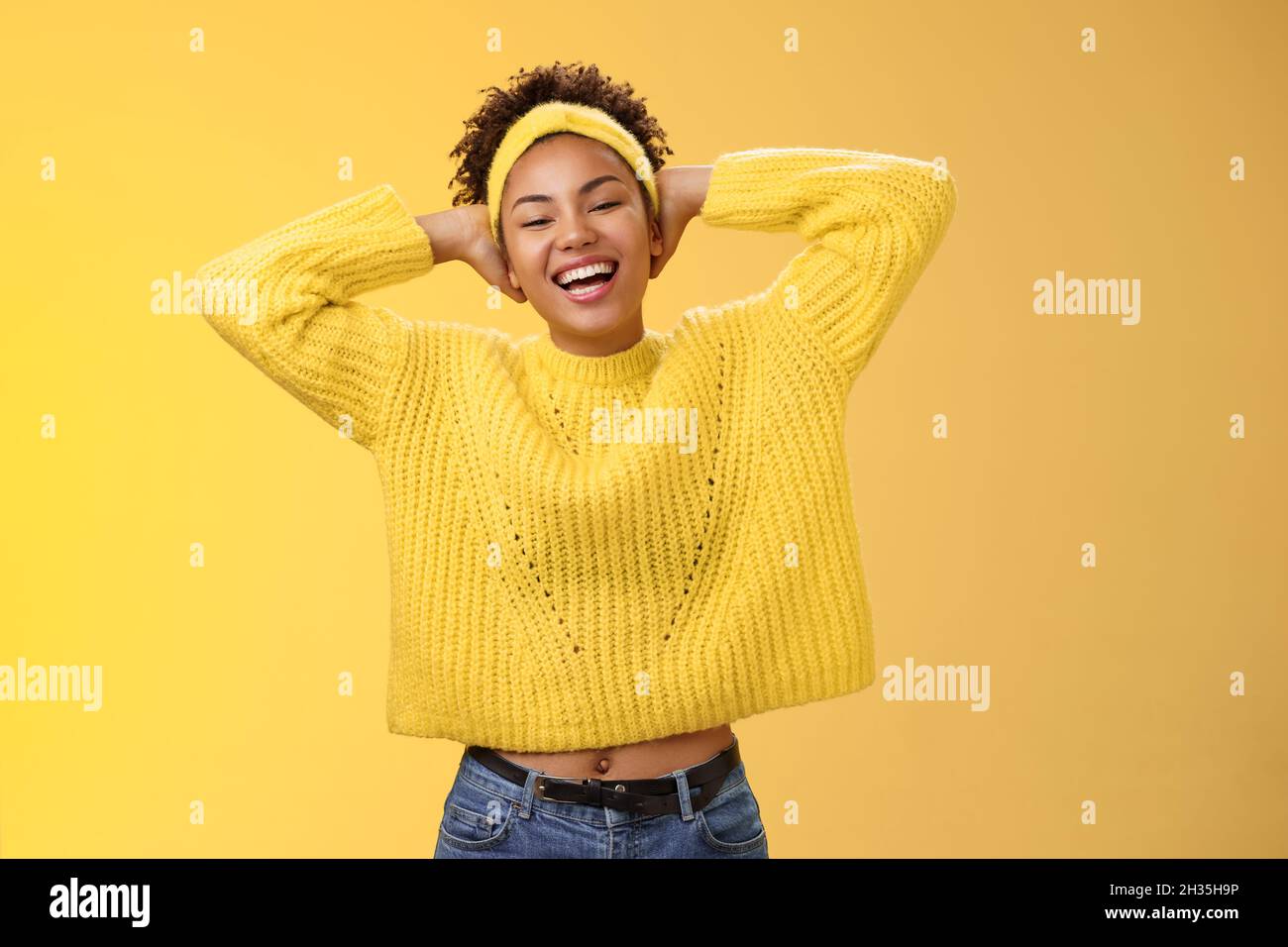 Carefree joyful lucky african-american female student in sweater ...