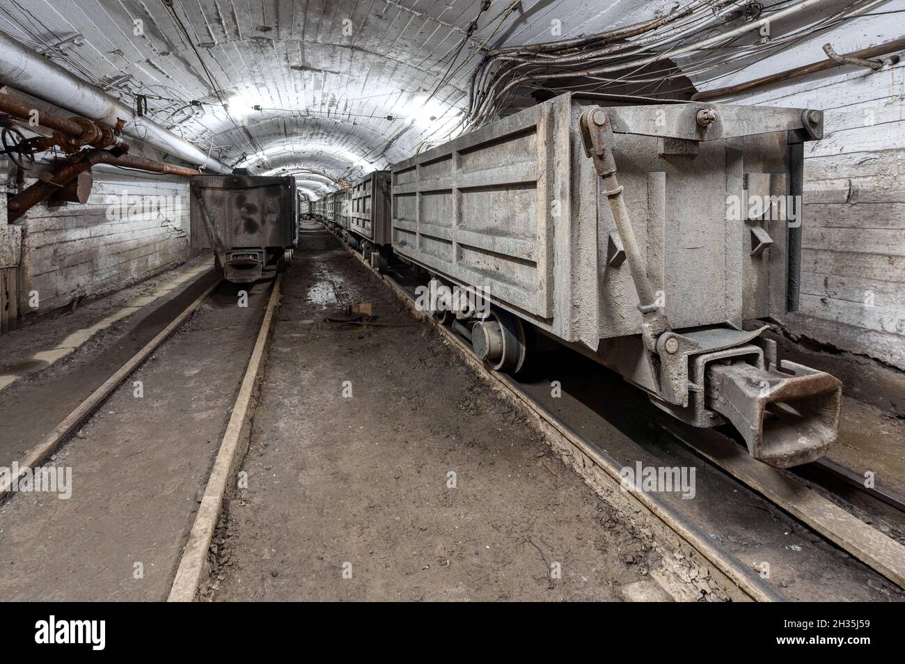 Underground mine railway for transporting ore. Freight trolleys and ...