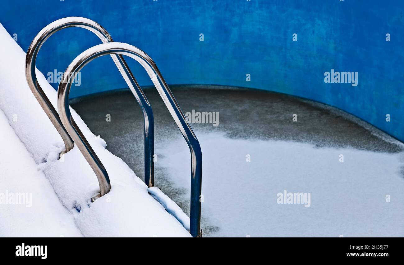 Ice swimming pool in the winter, Steps, hand-rails and garden chair in ...