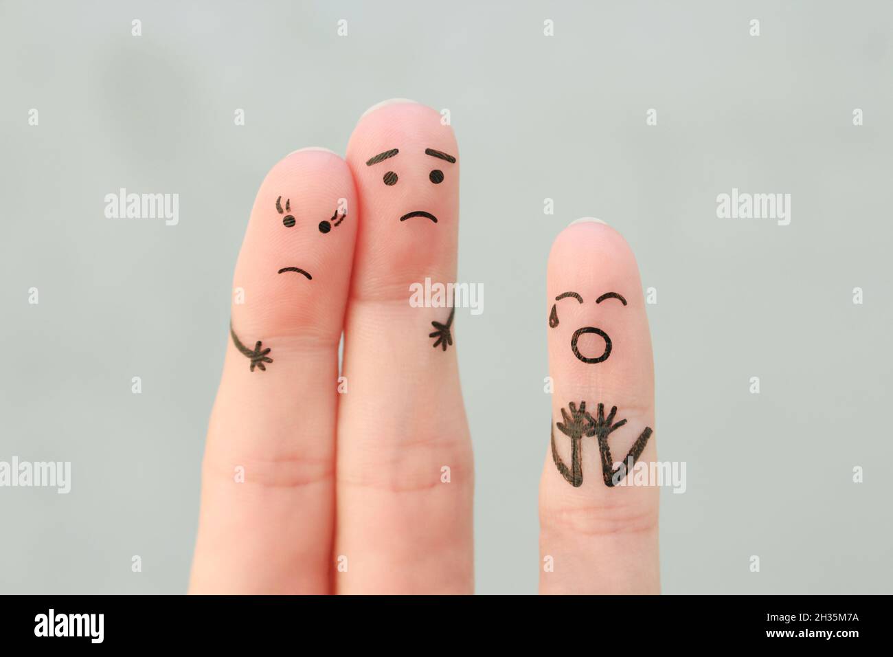 Fingers art of family during quarrel. Concept child is crying, parents ...