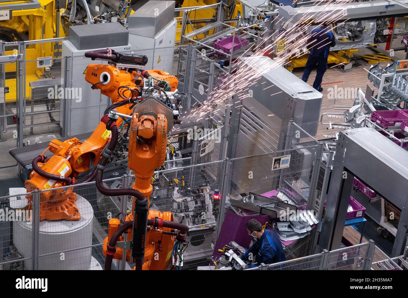 Munich, Germany. 22nd Oct, 2021. Robots from ABB work on parts of the ...