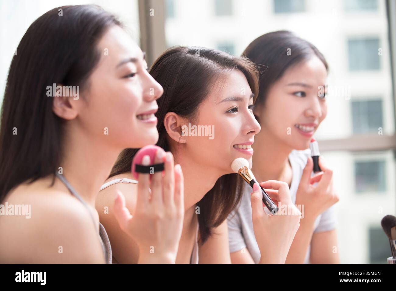 Three best friends making up together Stock Photo - Alamy