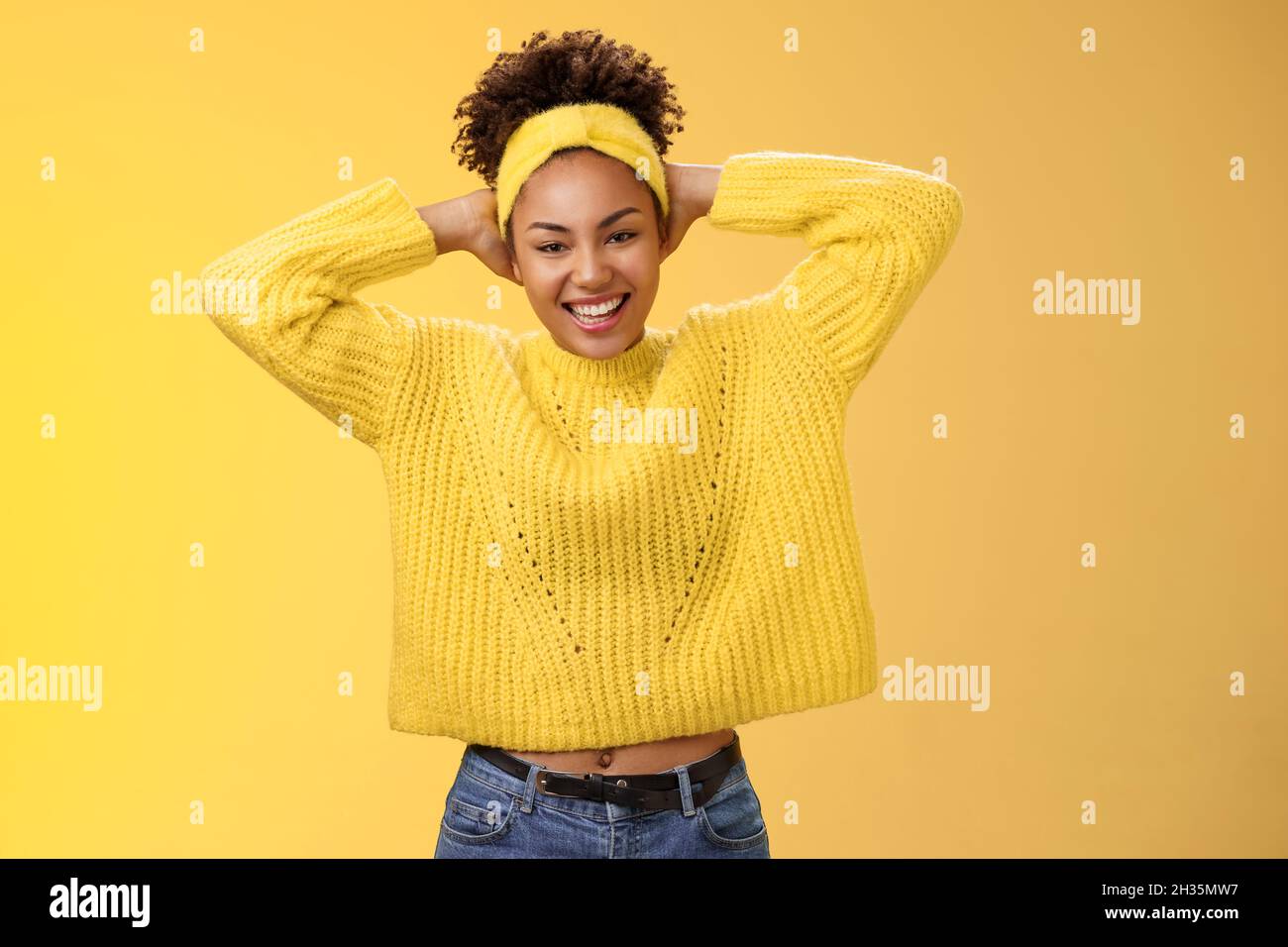 Attractive lucky optimistic african-american woman having fun lay back ...
