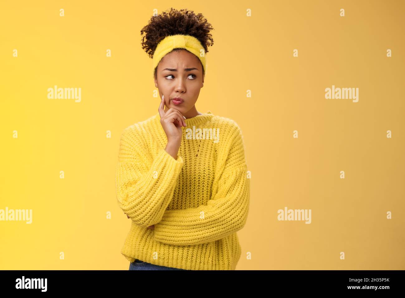 Perplexed unsure cute timid african-american female thinking how escape ...