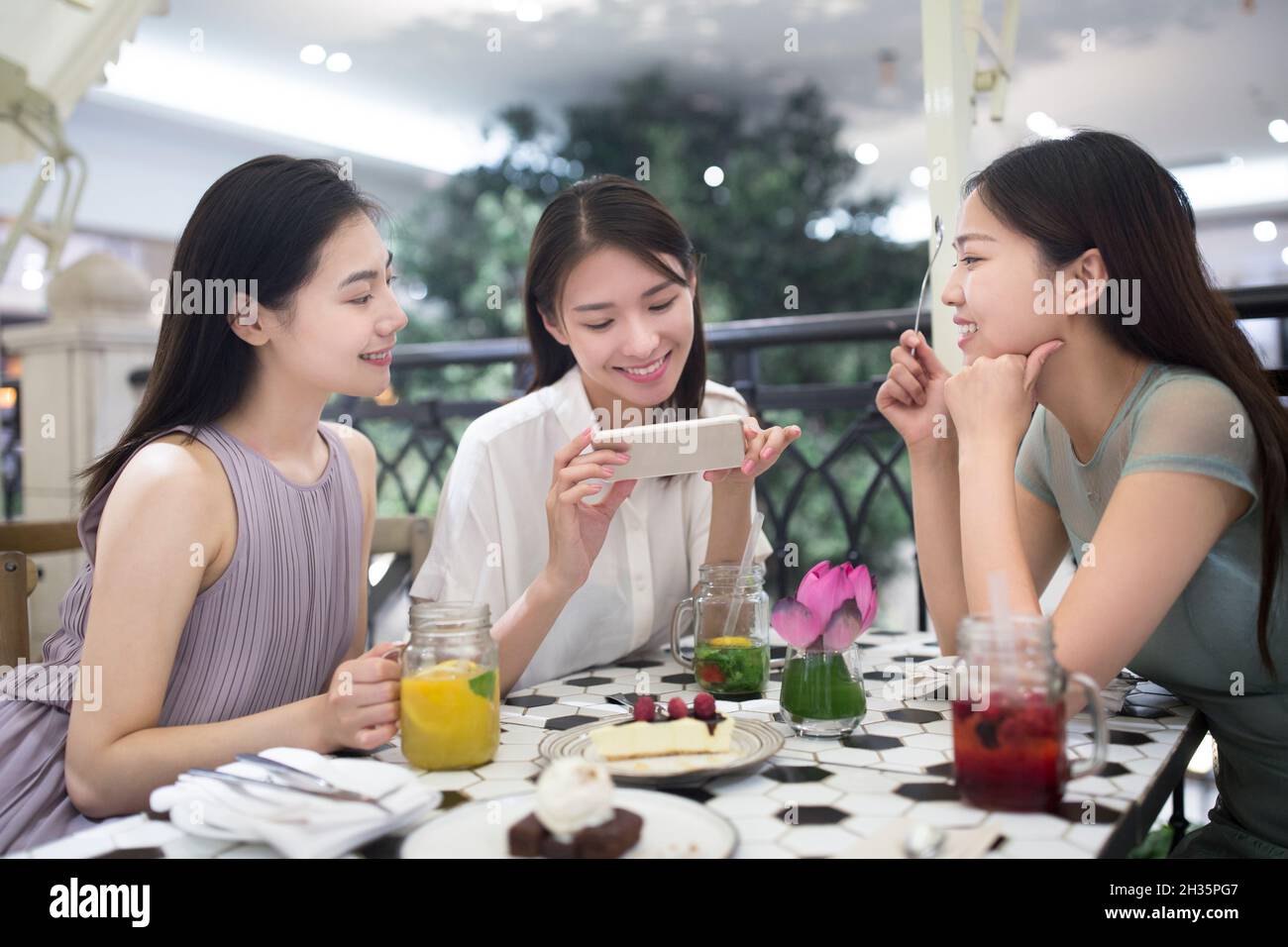 Three best friends getting together Stock Photo - Alamy