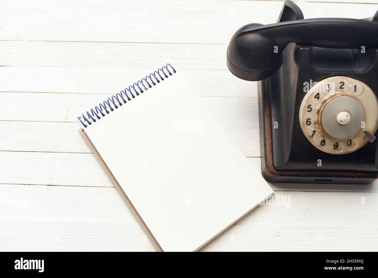 retro telephone he communication office notepad wooden background ...