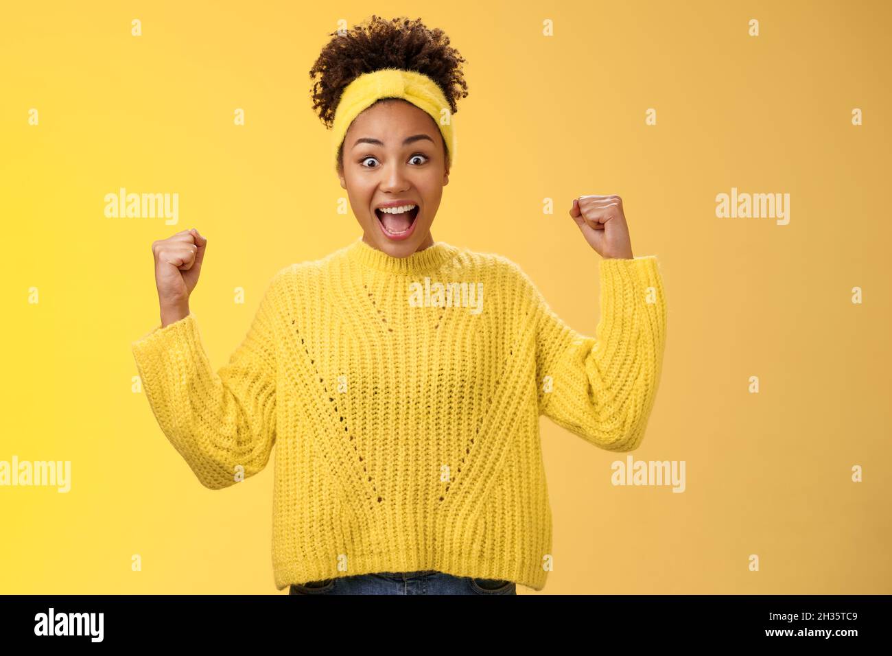 Yes finally prize mine. Excited surprised amused african-american girl ...