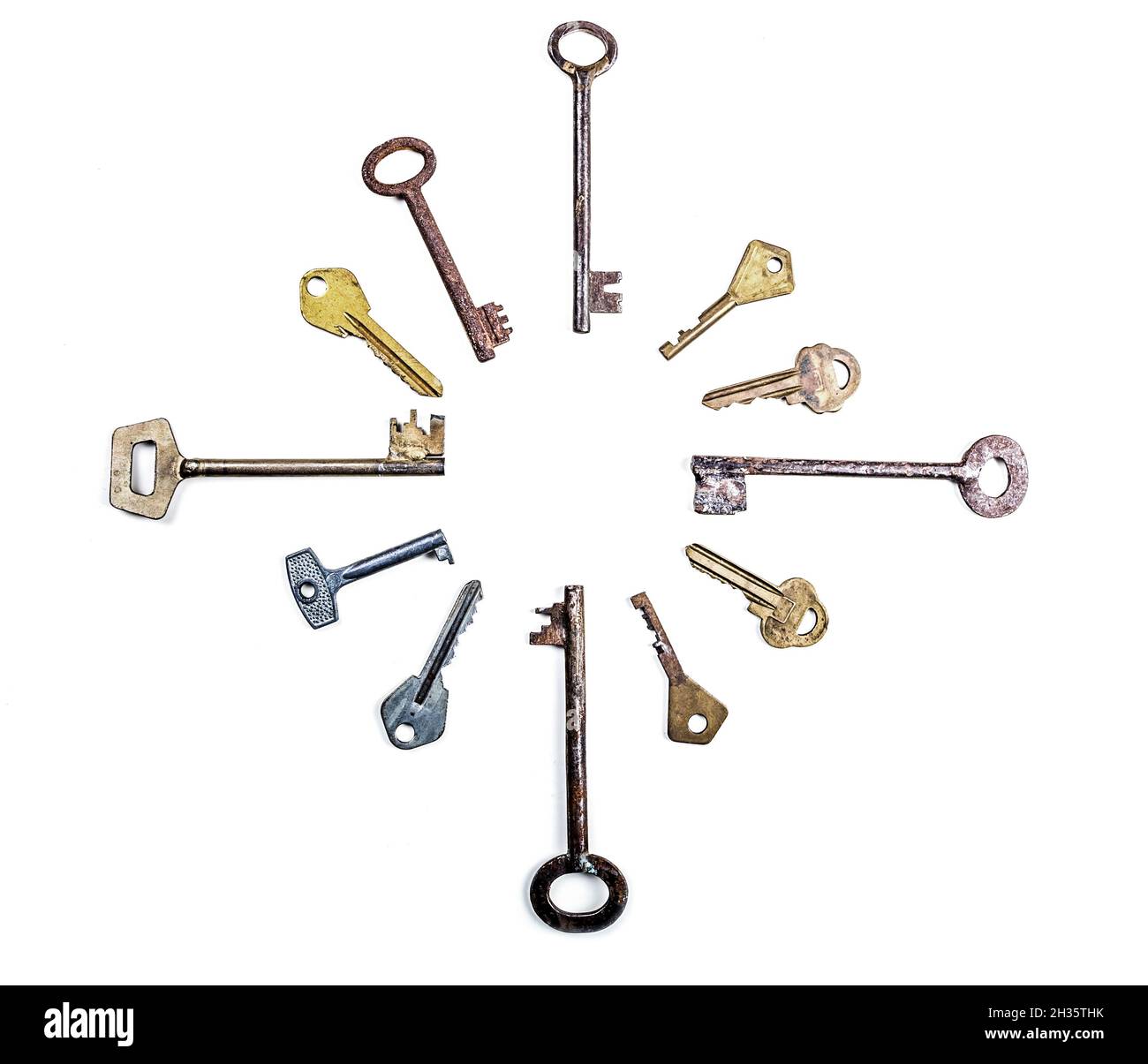 Many assorted old multi-colored metal antique keys of different shapes ...