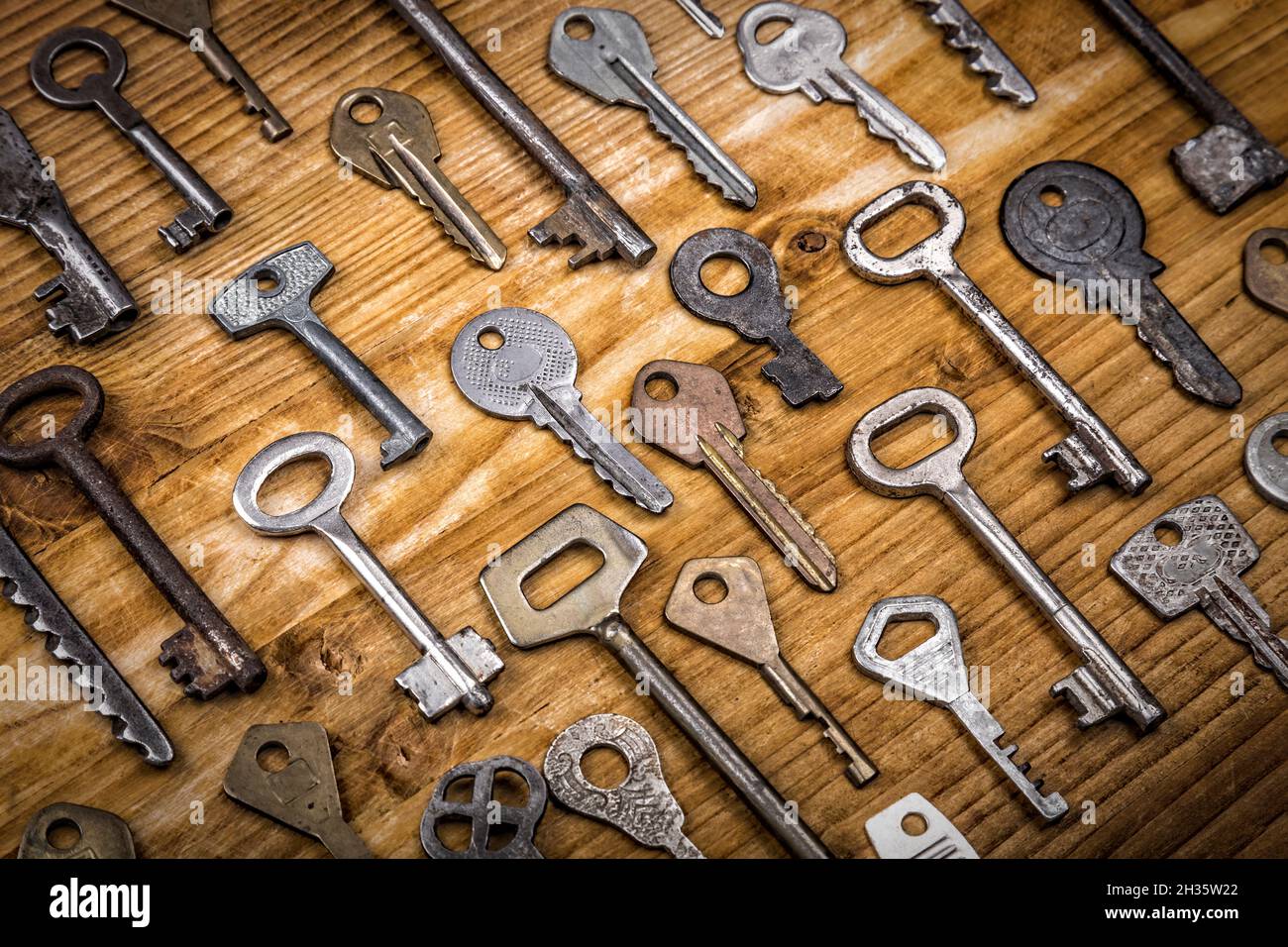 Many assorted old multi-colored metal antique vintage keys of different ...