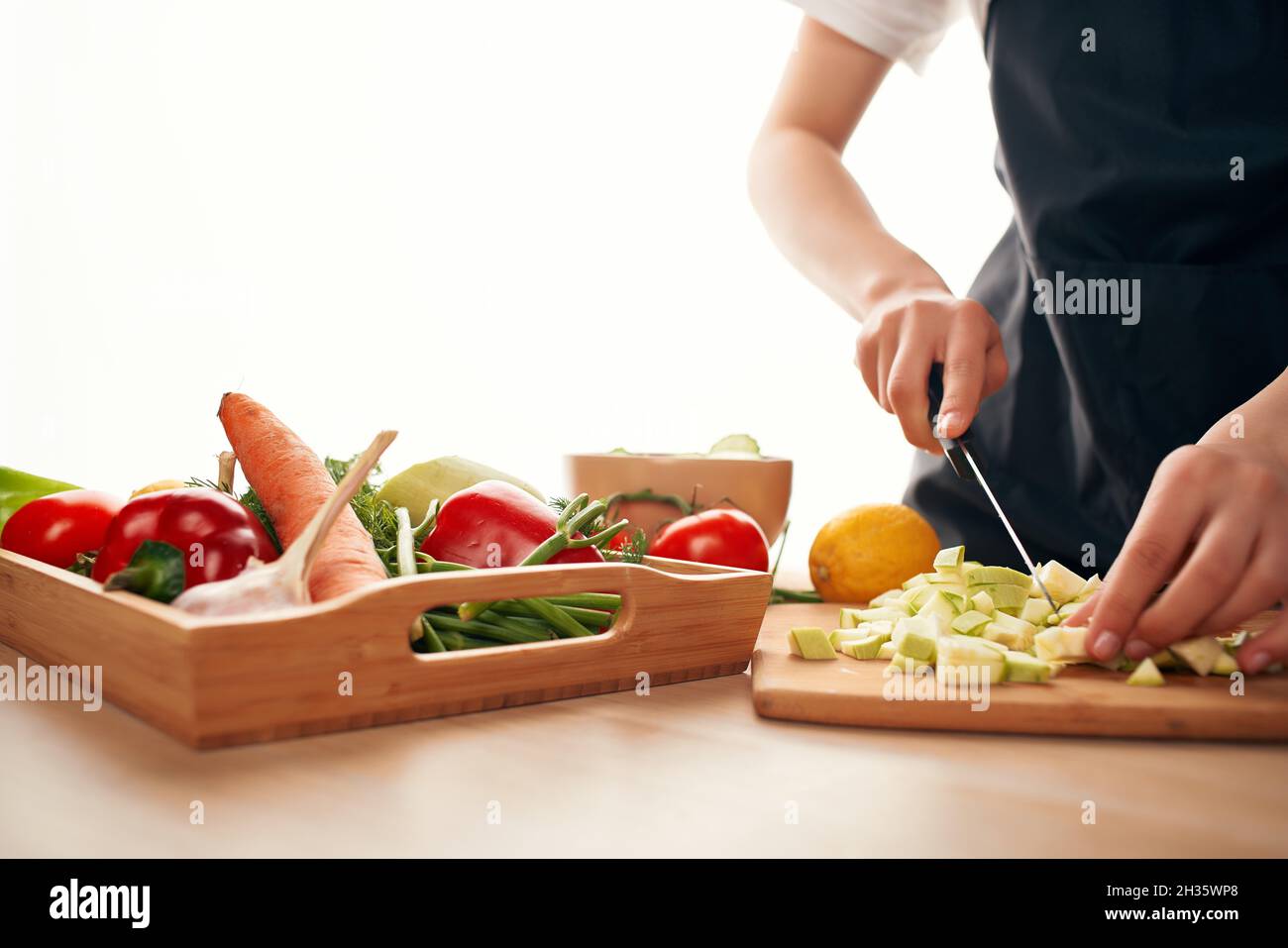 cutting vegetables healthy eating kitchen homework Stock Photo - Alamy