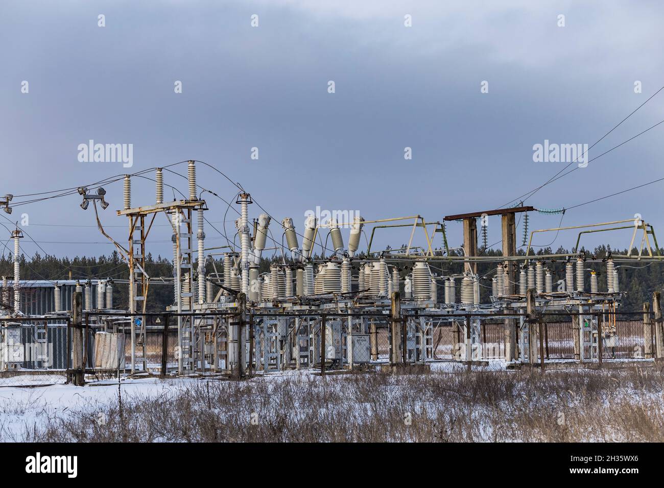 High voltage obsolete vintage electrical substation in winter. Closeup ...