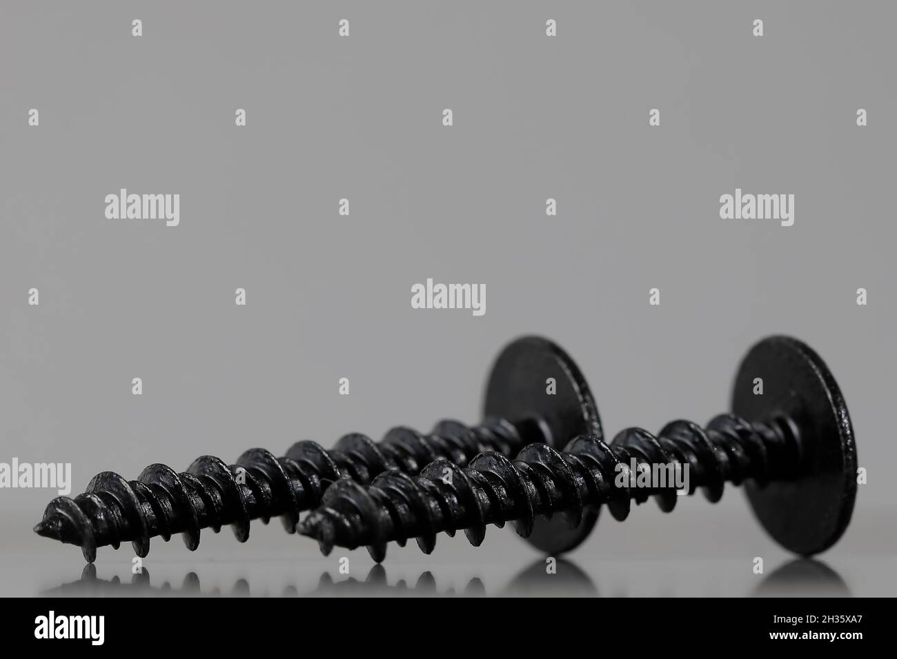 Black coated specially designed screws that are targeted for use in the ...