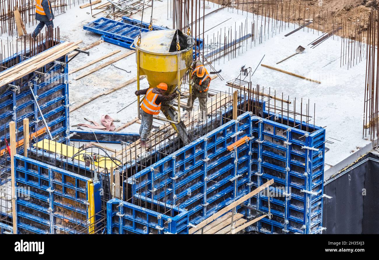 Concreting work at the construction site. ?onstruction workers pour ...