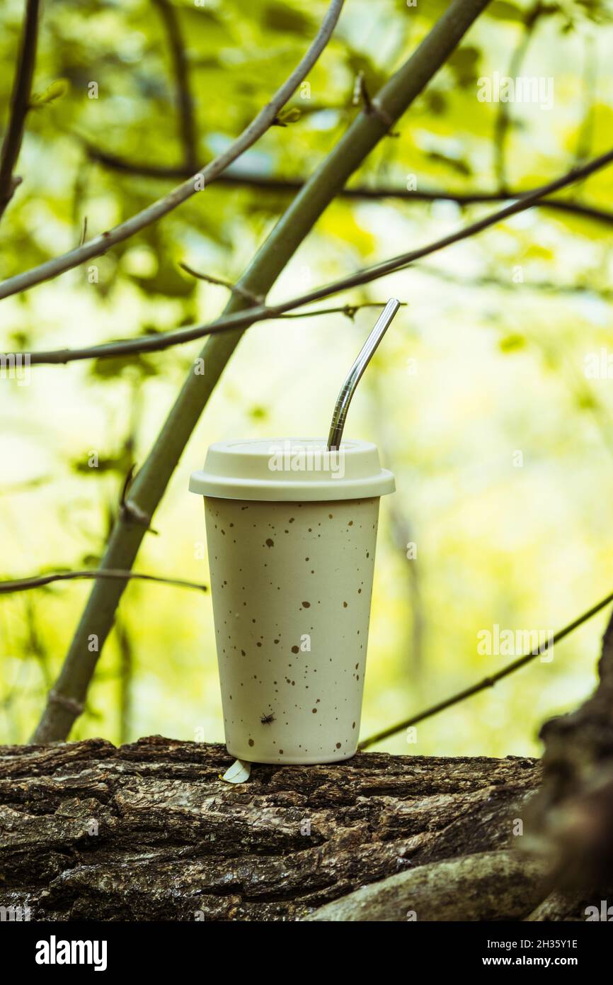 Reusable glass and straw on nature background Stock Photo - Alamy