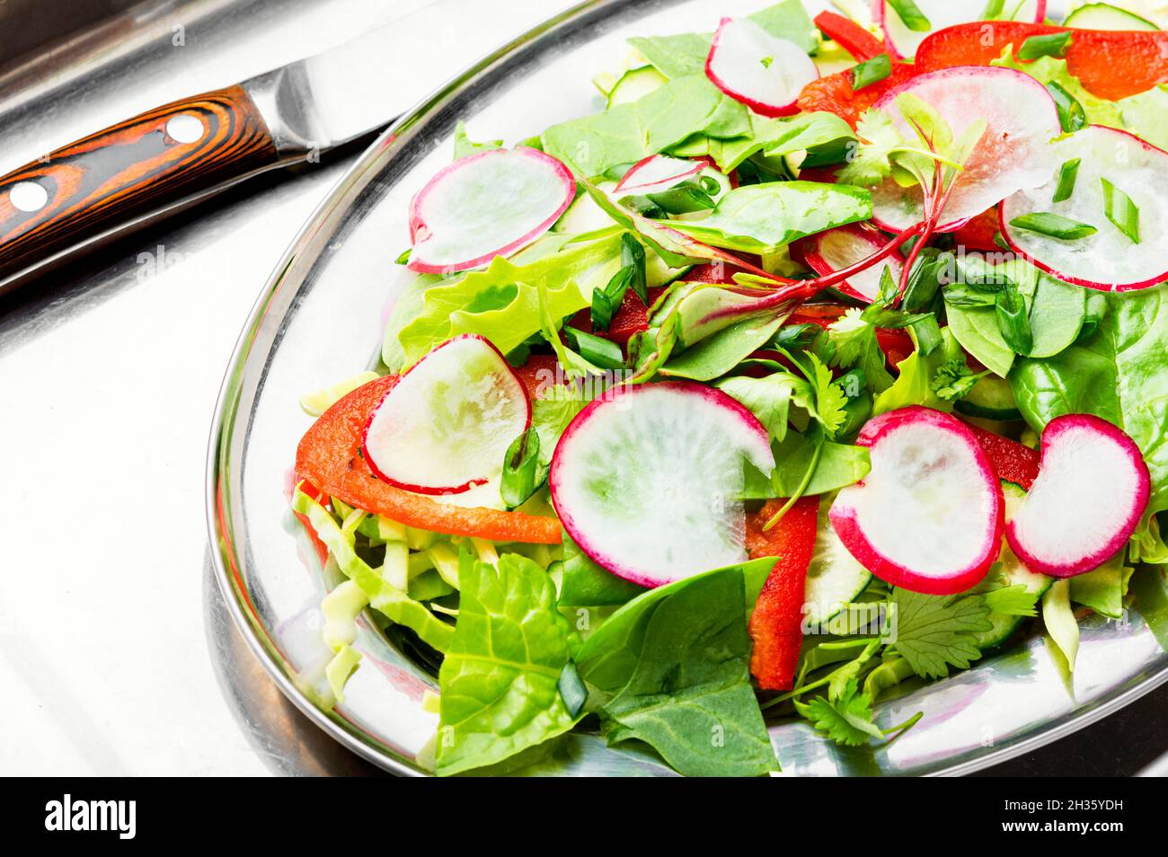 Healthy vegan salad made from radish,pepper,cabbage and greens.Salad ...