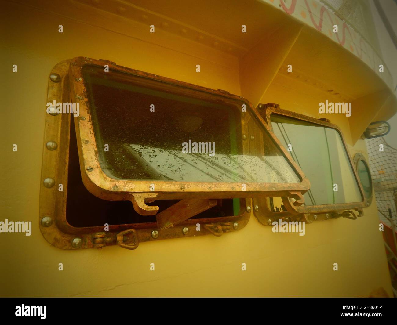 bronze window on a sailing ship Stock Photo - Alamy