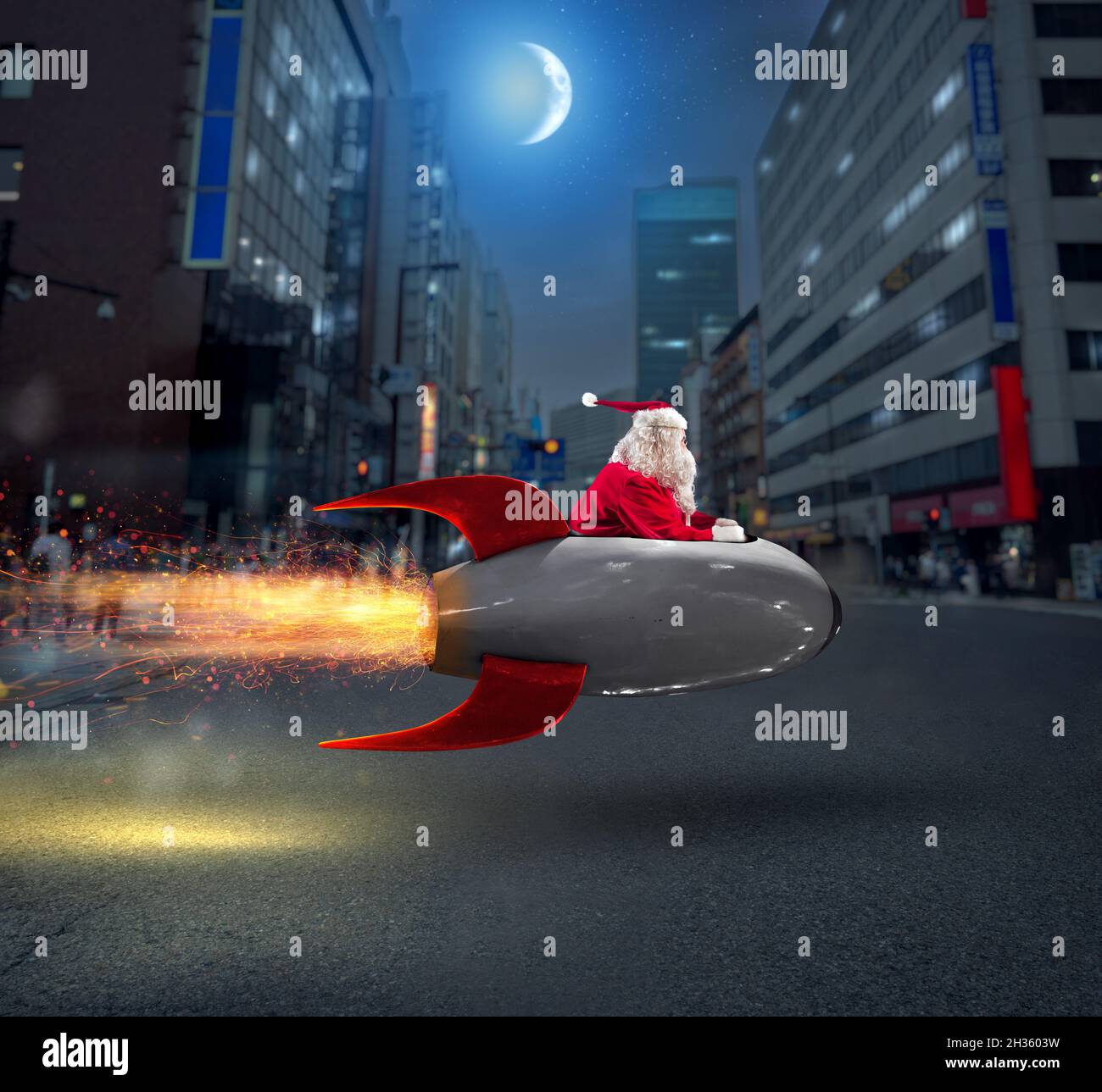 Santa claus delivers gifts with a fast space rocket Stock Photo - Alamy