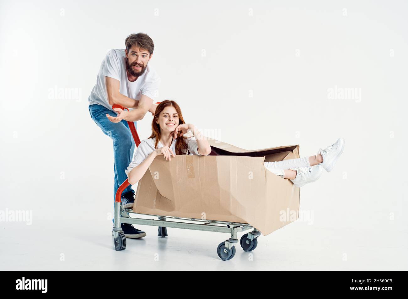 man next to woman shopping friendship light background Stock Photo - Alamy