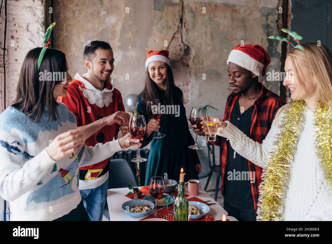 Group of people celebrating Christmas or New Year eve Stock Photo - Alamy