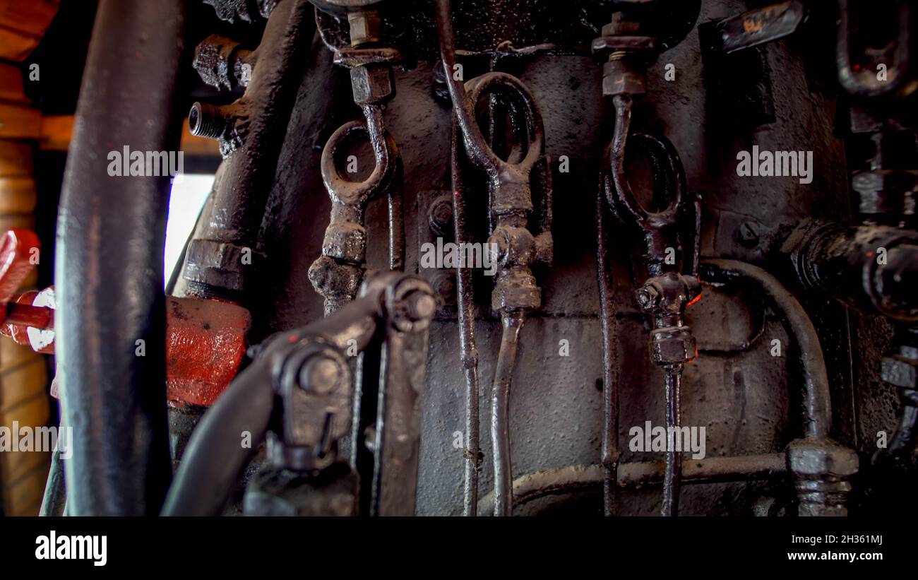Closeup photo of old rusty metal pipes and valves at old steam ...