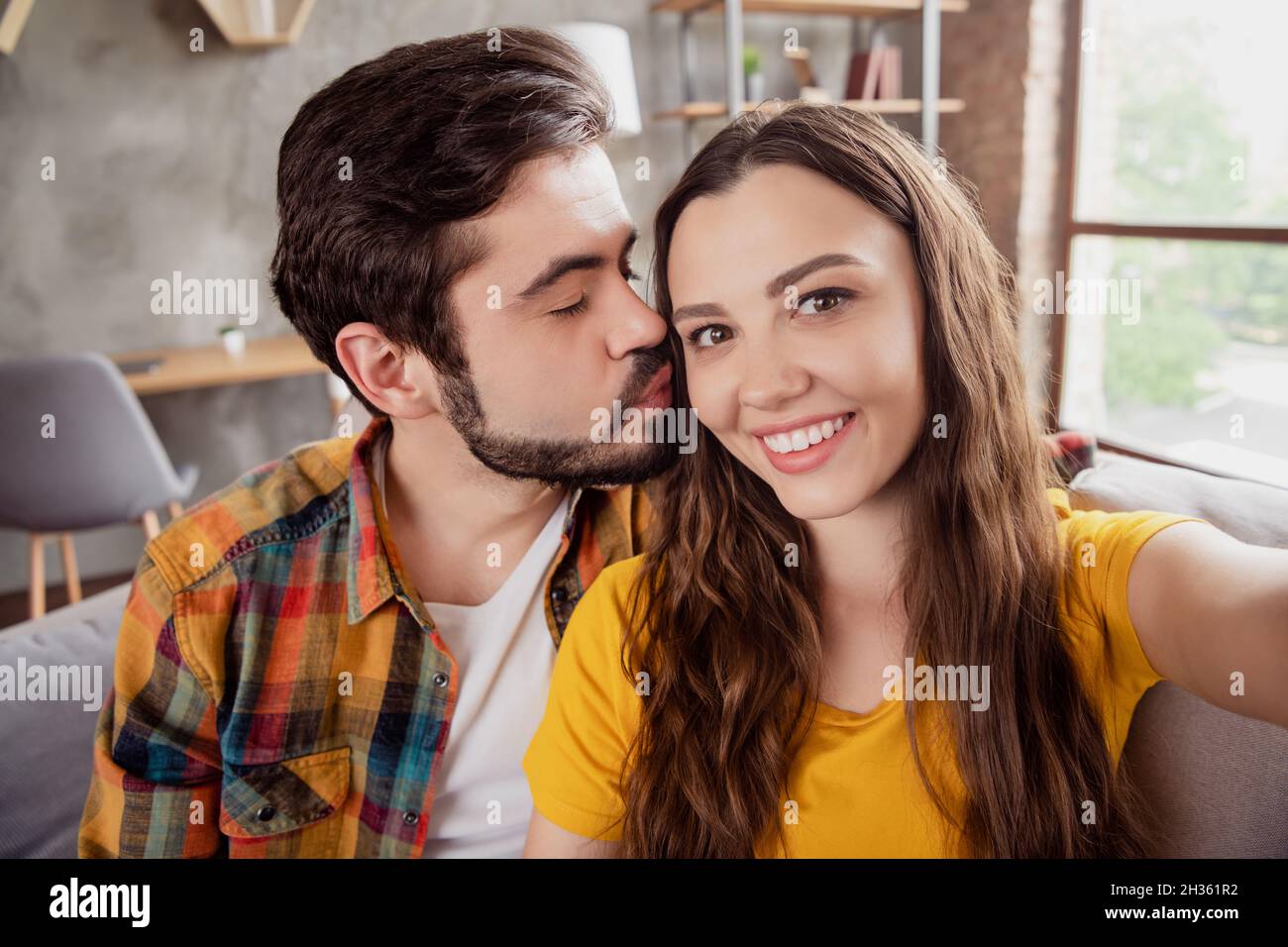 Photo of romantic adorable young lovers dressed casual clothes tacking ...