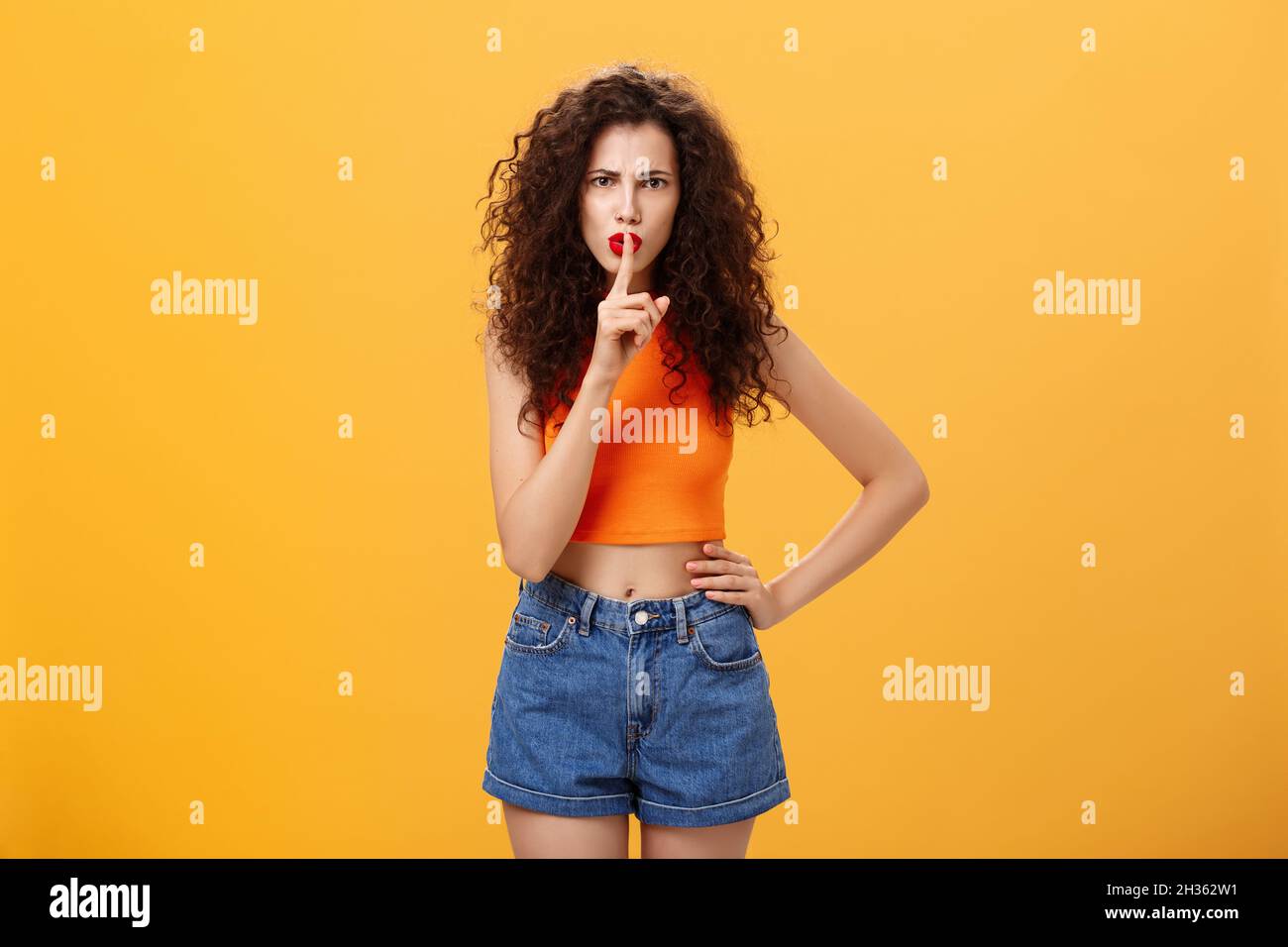 Sister displeased sibling saying cursing words standing serious and ...